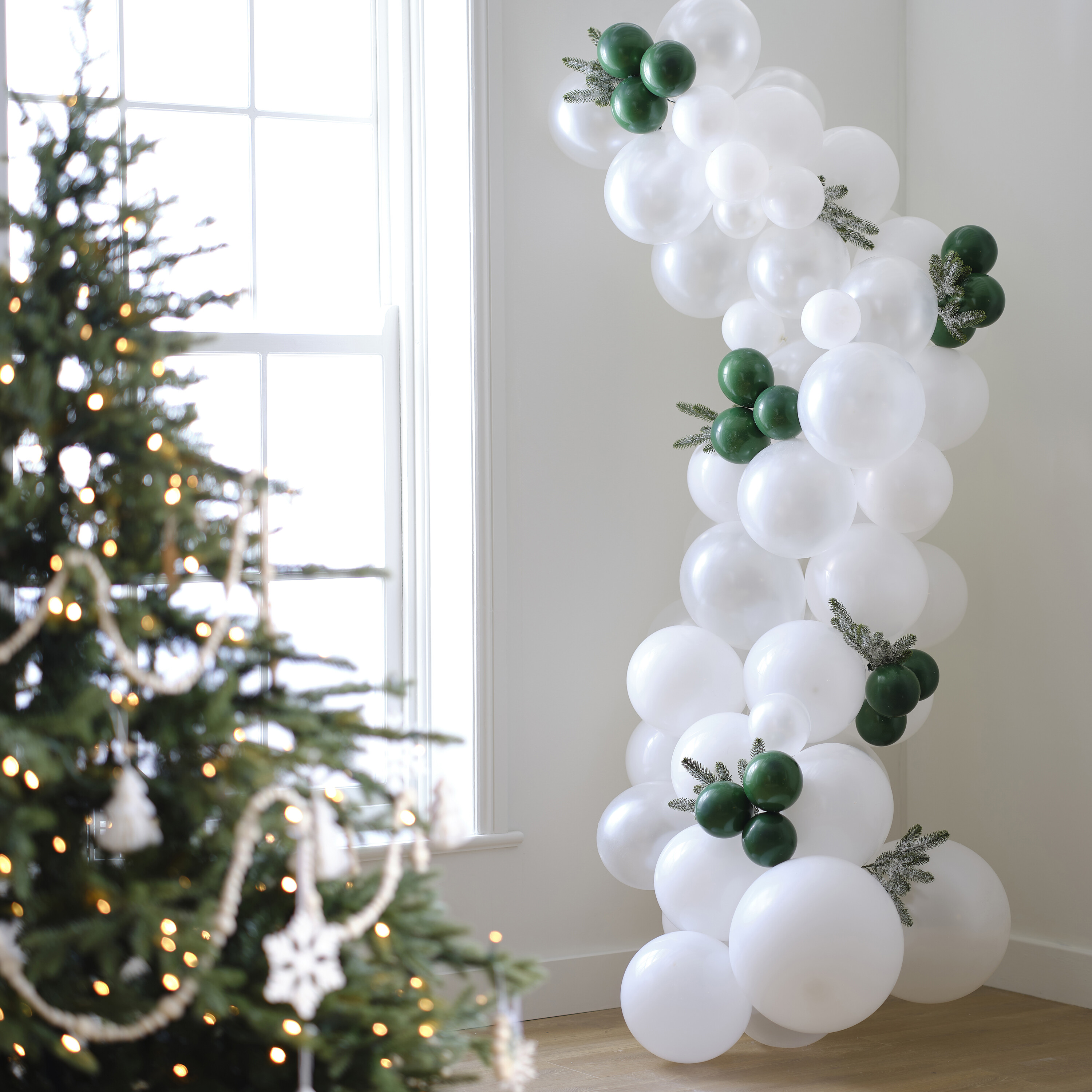 White & Dark Green Snowy Christmas Balloon Arch with Frosted Foliage ...